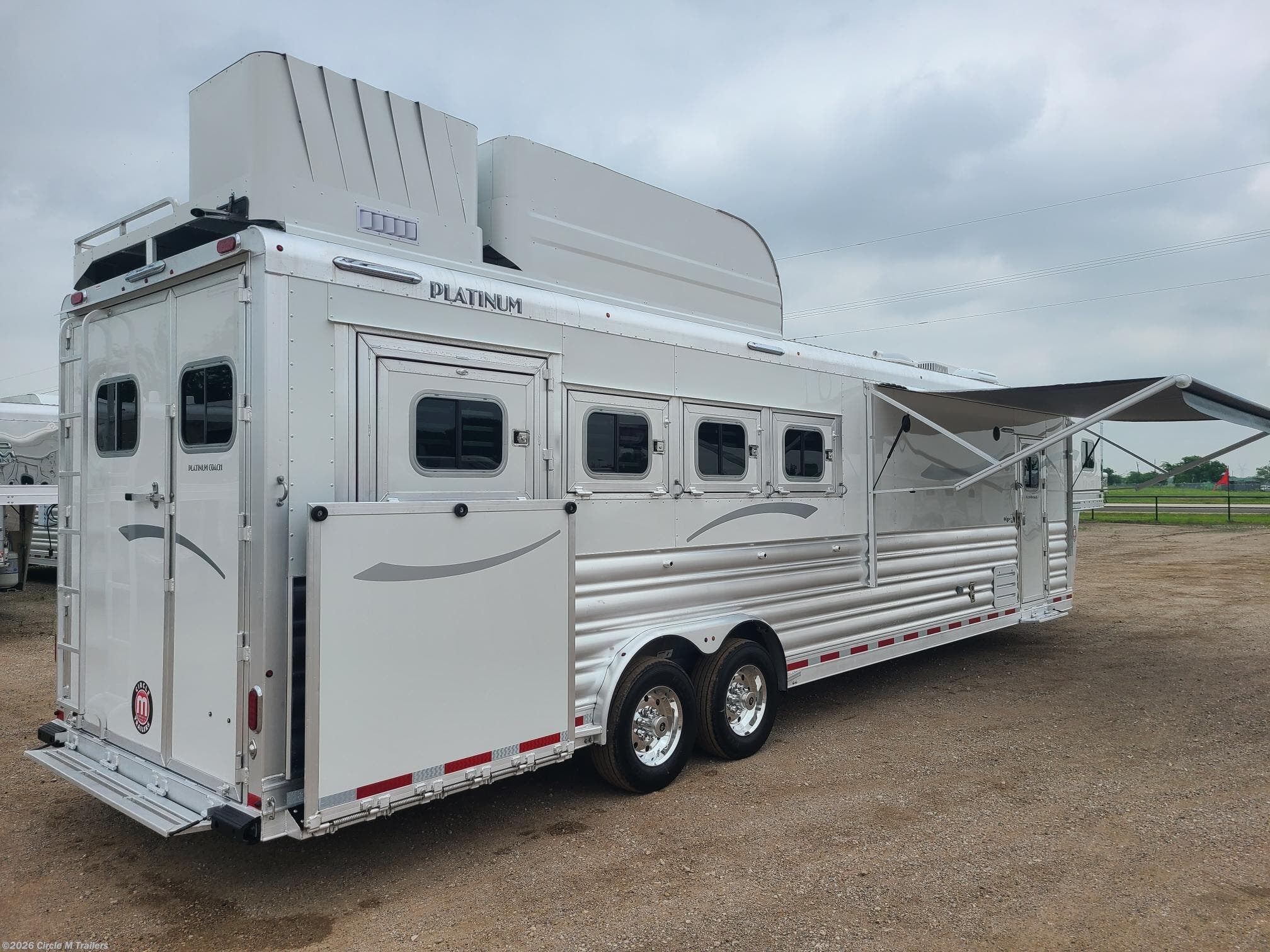 2026 Platinum Coach Outlaw 4H 13'8" SW Couch & Half-Dinette Side Load